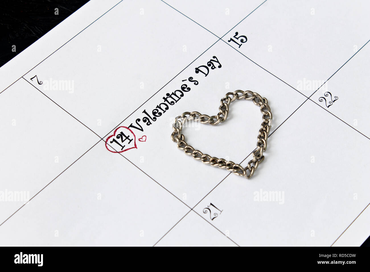 Calendar page with hearts on February 14, Valentine's Day on a black ...