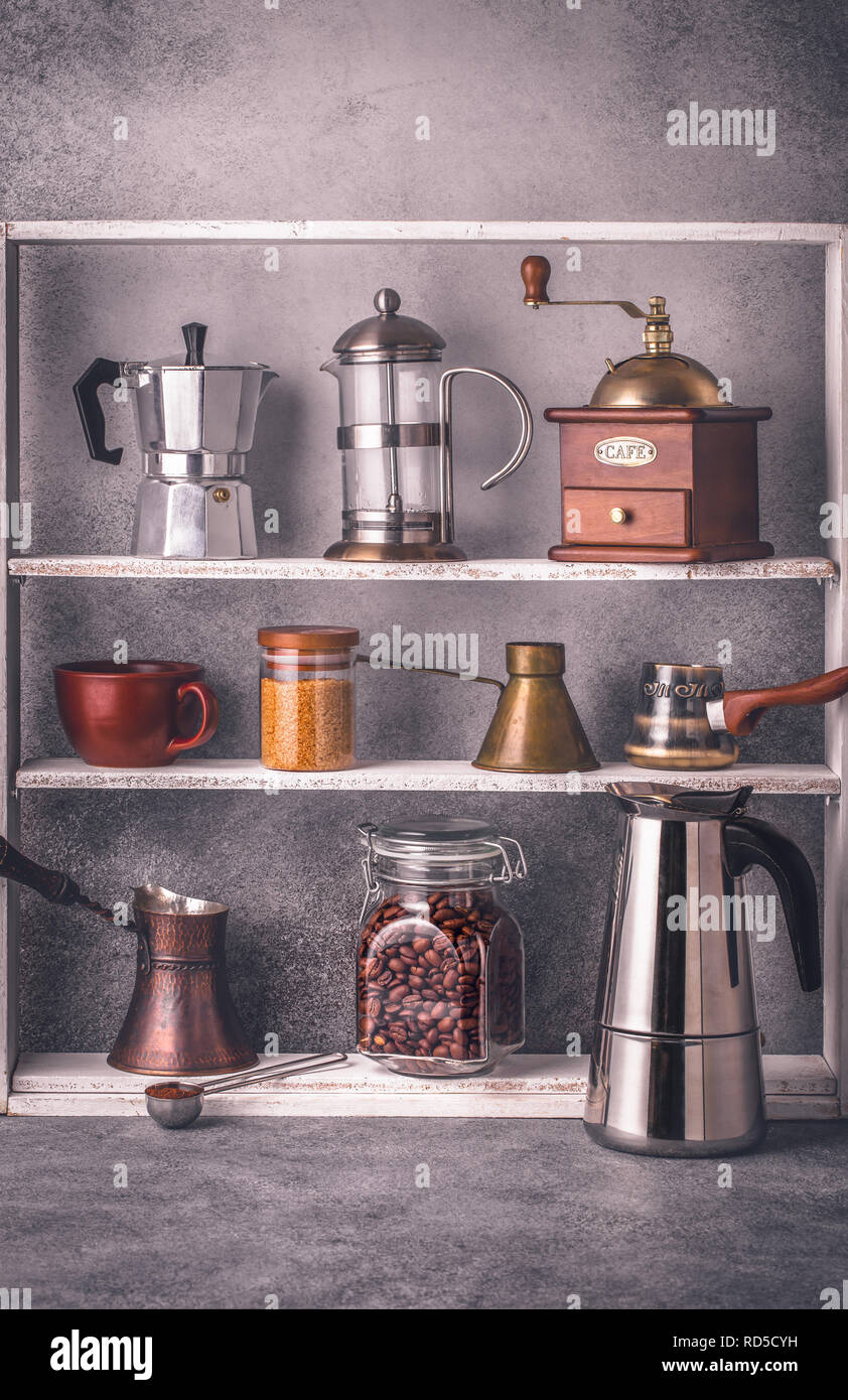 Coffee making tools on shelves Stock Photo - Alamy