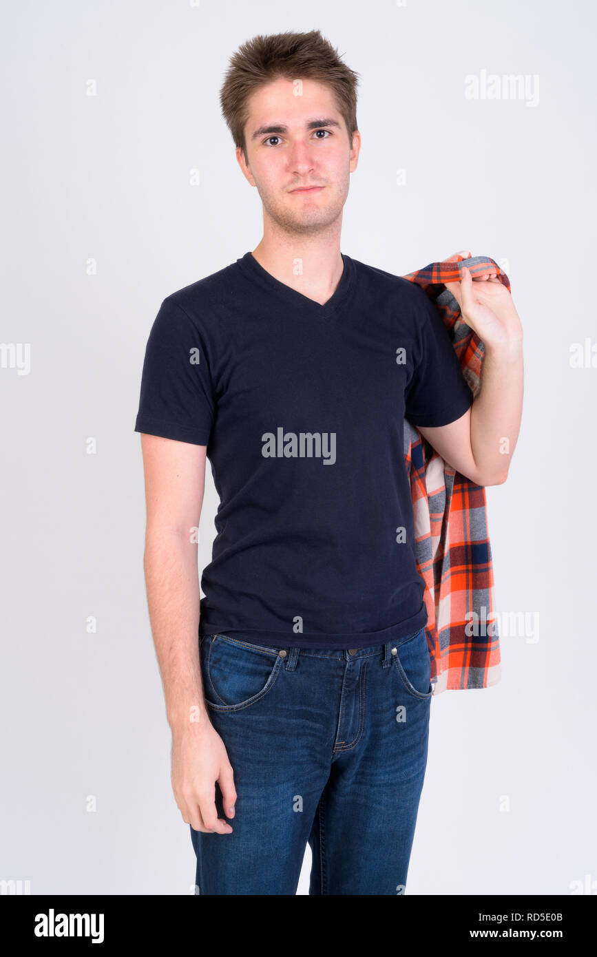 Young handsome man carrying jacket over shoulder Stock Photo - Alamy