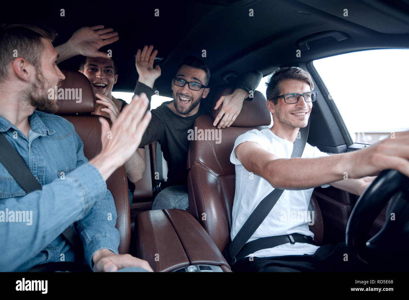 close up.happy friends talking in the car Stock Photo - Alamy