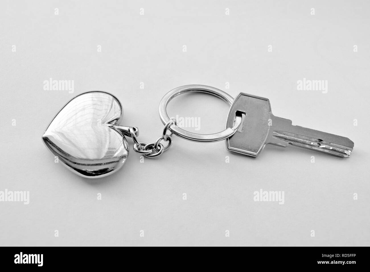 key and heart of metal on a white background Stock Photo - Alamy