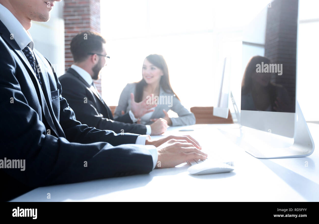 office employees sitting at their work Desk Stock Photo - Alamy