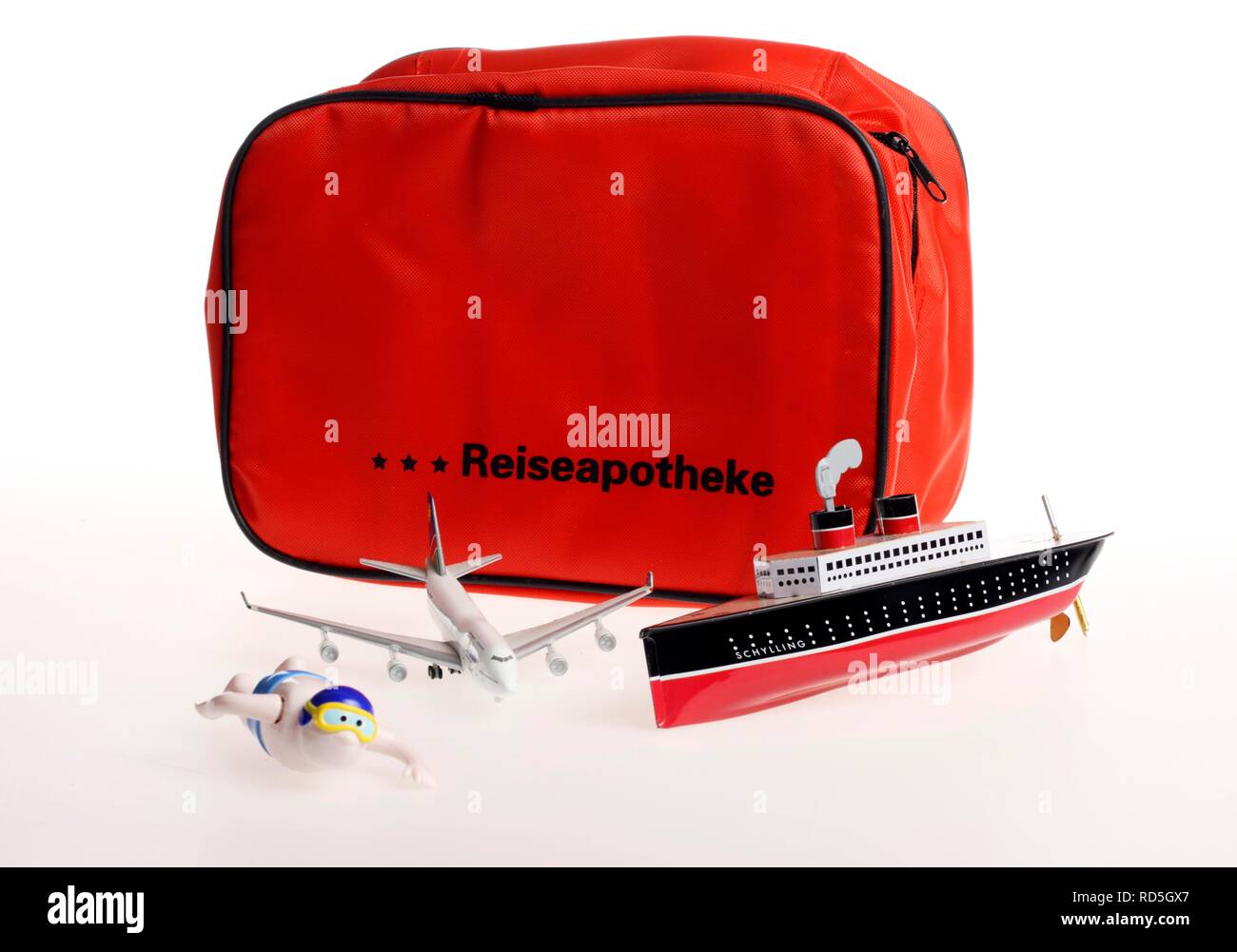First-aid kit, miniature ship, miniature airplane, diver figure Stock ...