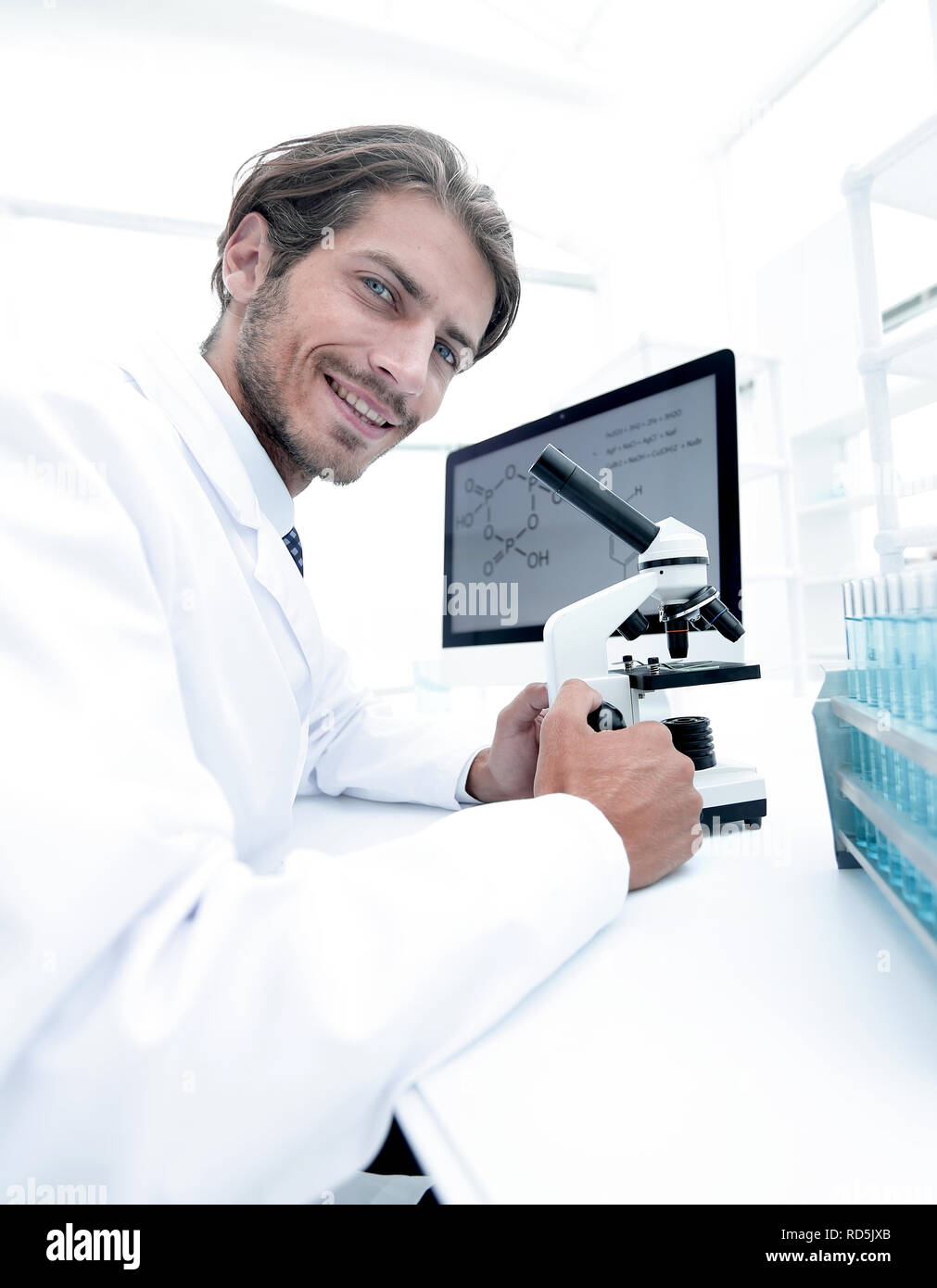 Student in biology using microscope in training class Stock Photo - Alamy