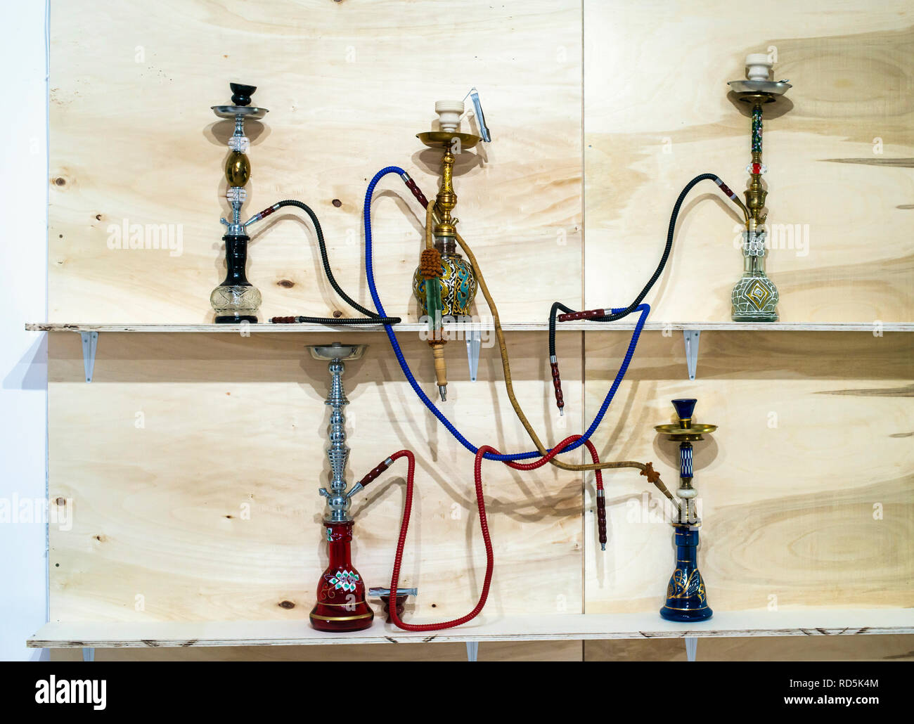 Ancient hookahs on shelf. Various models and colours. Arabic culture ...