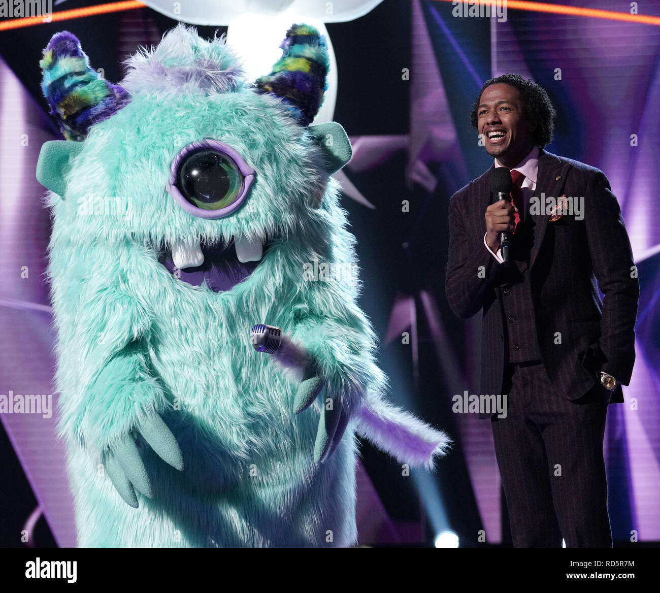 THE MASKED SINGER, from left: Monster, host Nick Cannon, 'Mask On Face ...