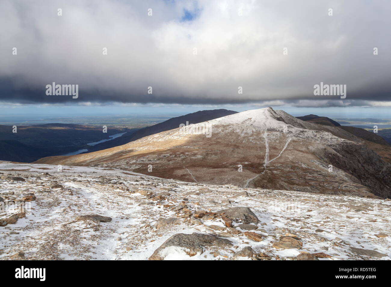 Viewed from the side of Gylder Fawr, a low lying cloud sits above the ...