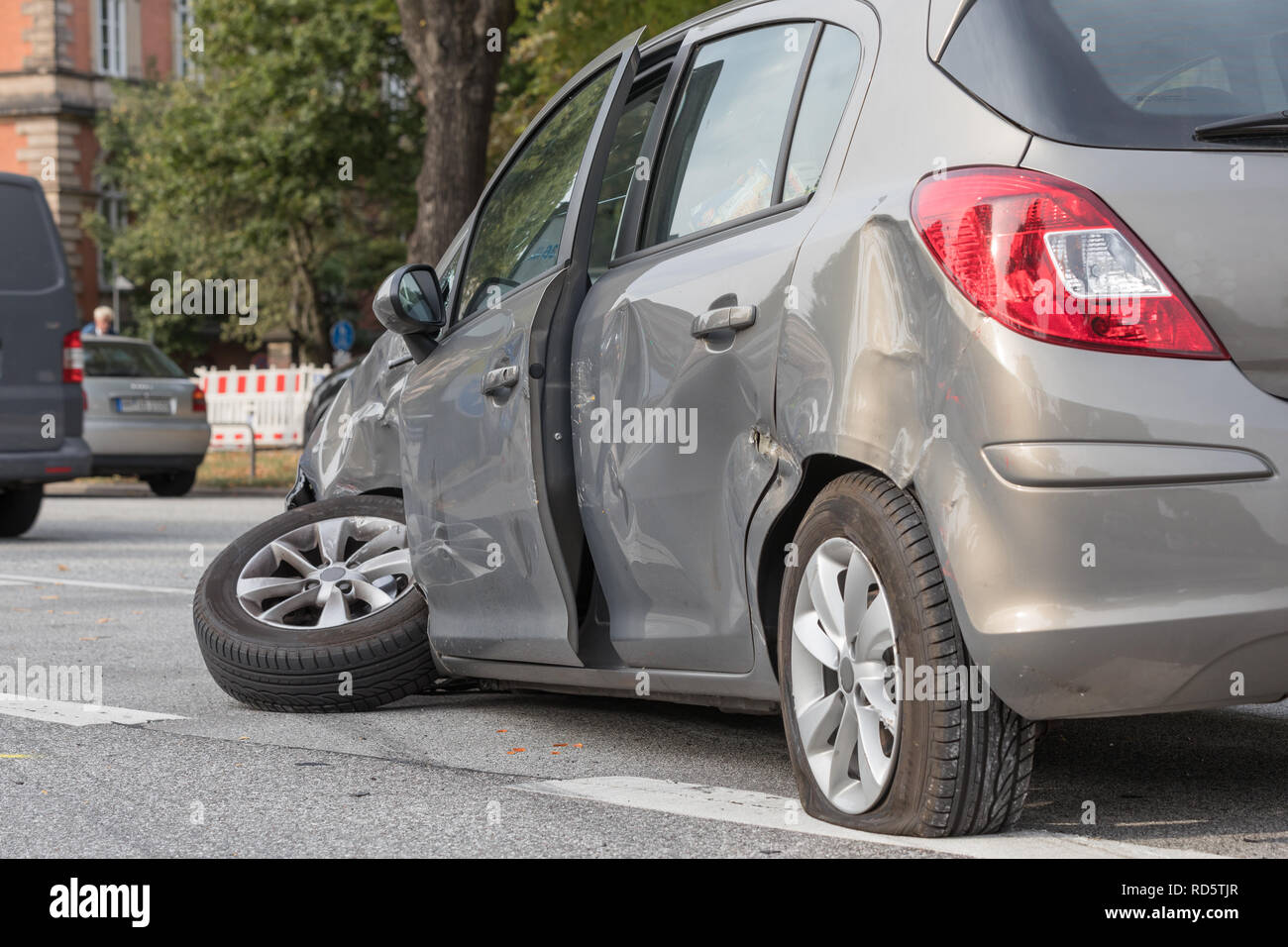 damaged small grey car Stock Photo - Alamy