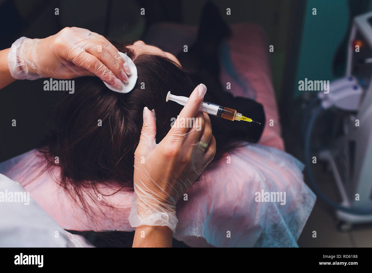 Beautiful woman getting injection for hair growth Stock Photo - Alamy