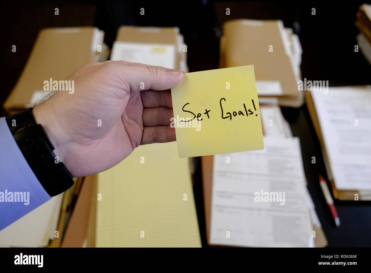 Sticky Note in Hand Businessman Desk Files Folder Working Message ...