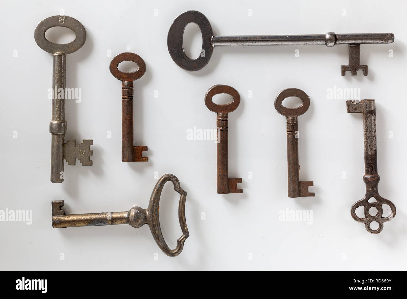 Flat lay of a set of old rusty keys on a white background Stock Photo ...