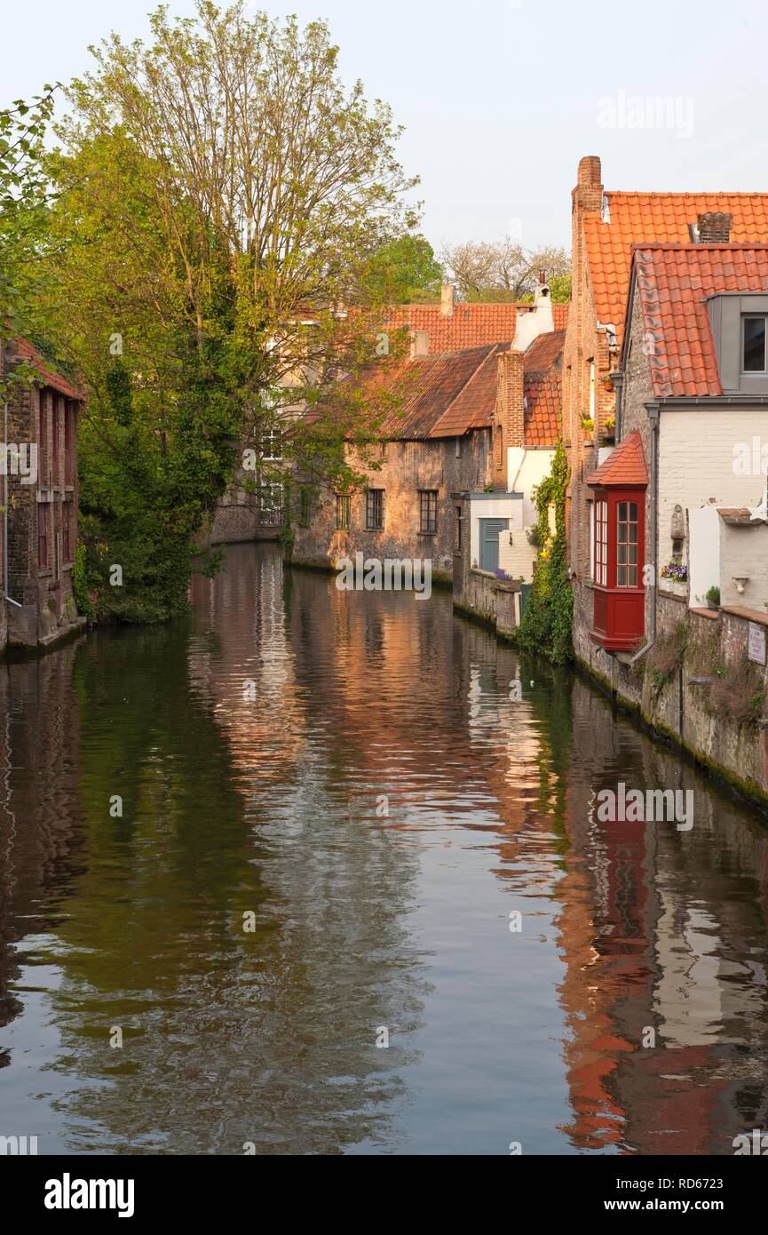 Buildings reflecting in a canal, historic centre of Bruges, Unesco ...