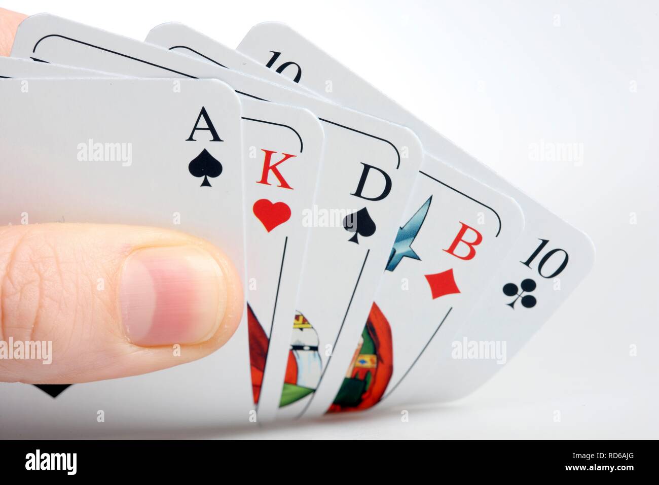 Hand holding playing cards Stock Photo - Alamy