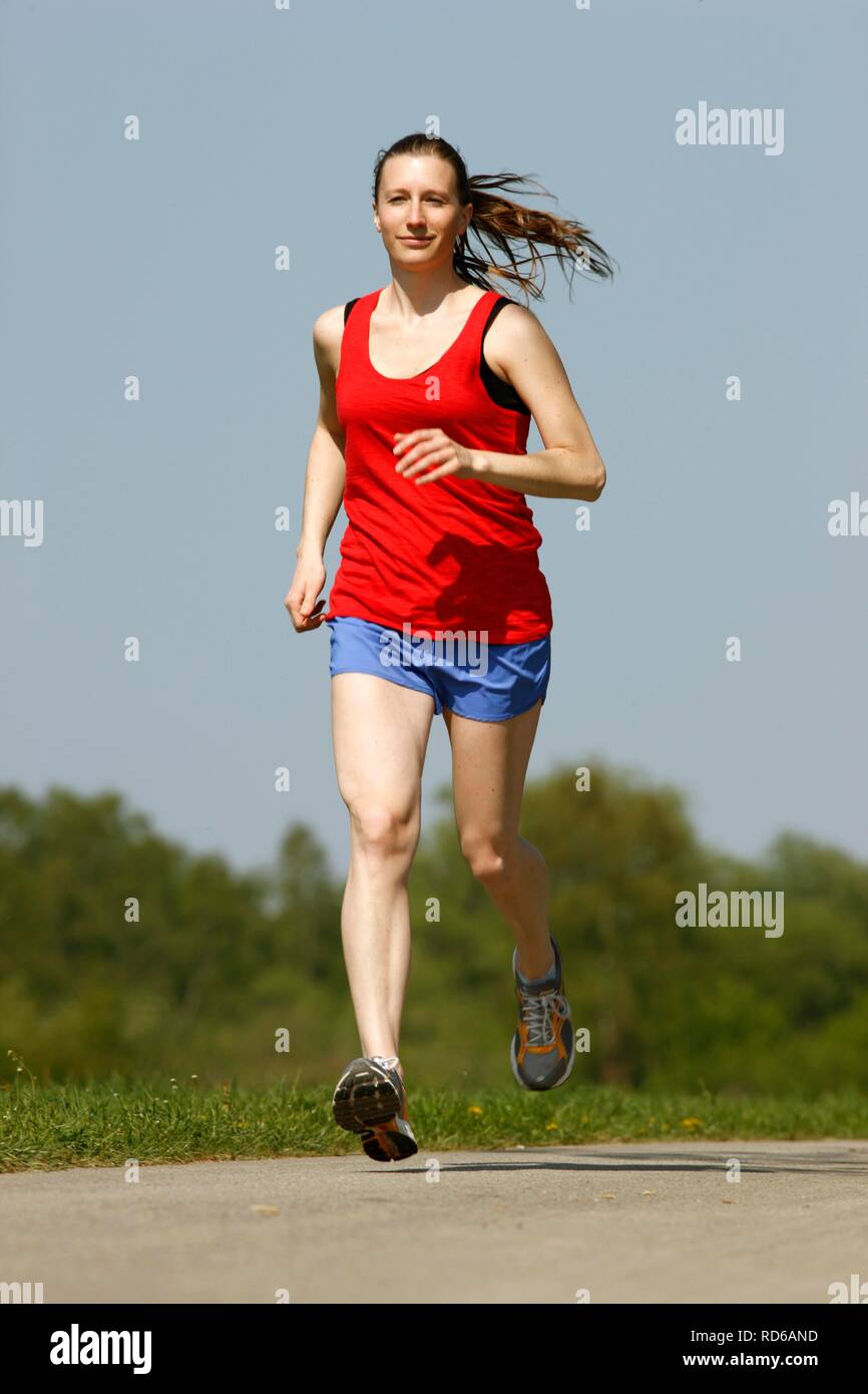Recreational runner, young woman, 25-30 years, jogging Stock Photo - Alamy