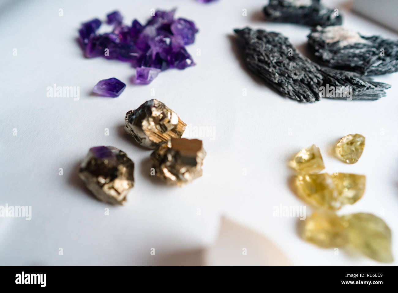 Collection of beautiful precious stones on white table Stock Photo - Alamy