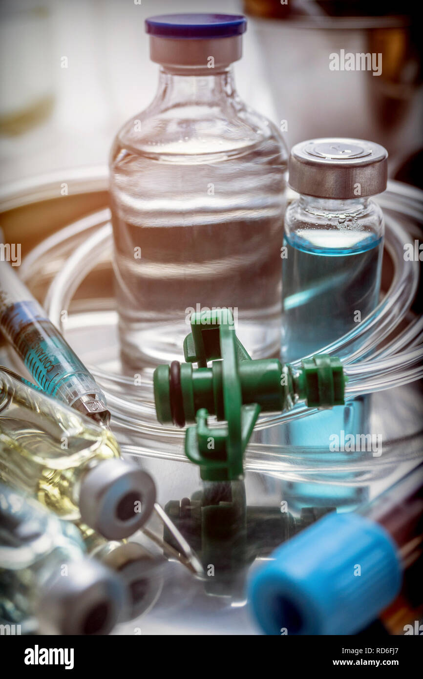 Multiple vial and syringe in a tray metal, conceptual image Stock Photo ...