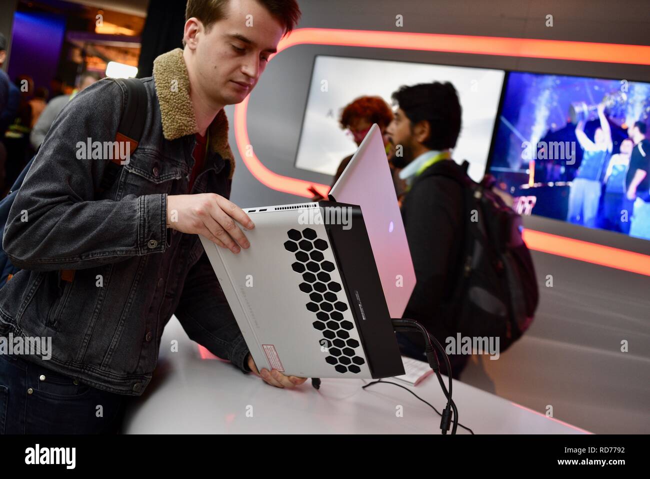 Male CES attendee at Dell booth, trying out recently launched Alienware ...