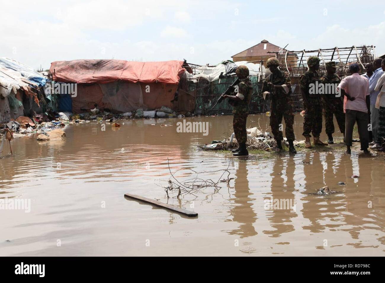 AMISOM peacekeepers seen assessing sitaution of a submerged IDP camp in ...