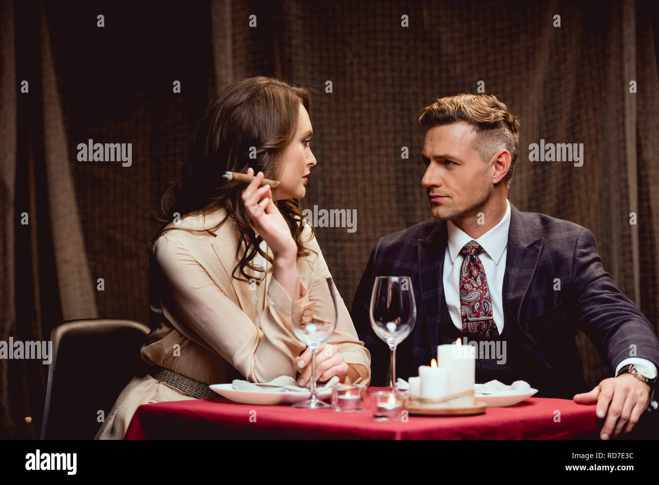 Woman smoking cigar dinner hi-res stock photography and images - Alamy