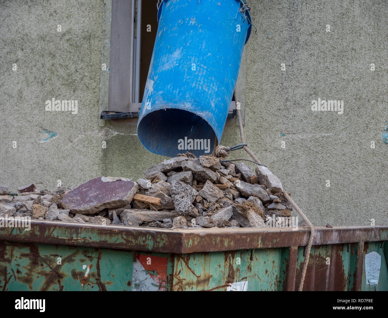 Building rubble chute with container Stock Photo - Alamy