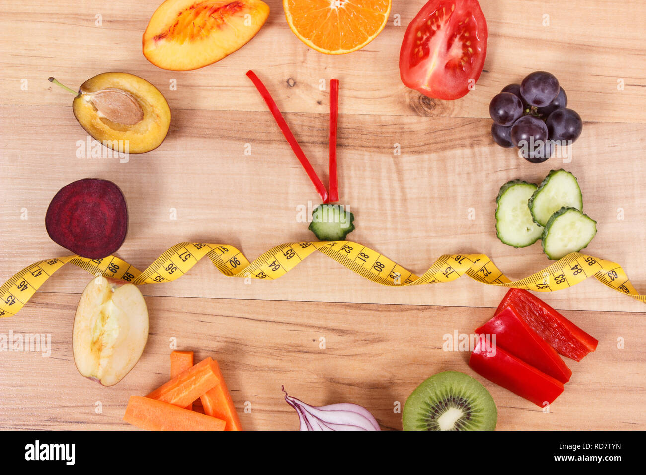 Fresh ripe fruits with vegetables and centimeter. Healthy sporty ...