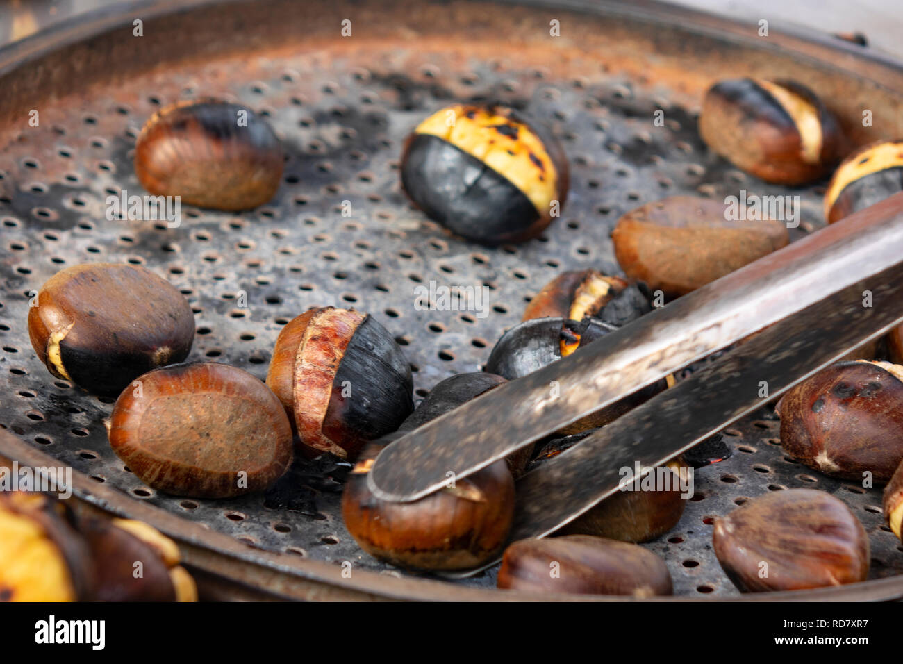 Fried chestnuts on the street. Street food. Roasted chestnuts Stock ...
