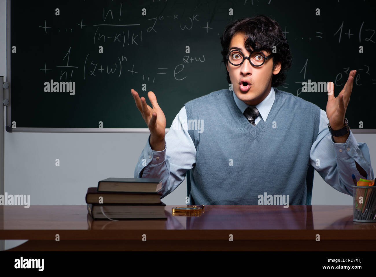 Mathematics teacher showing board hi-res stock photography and images ...