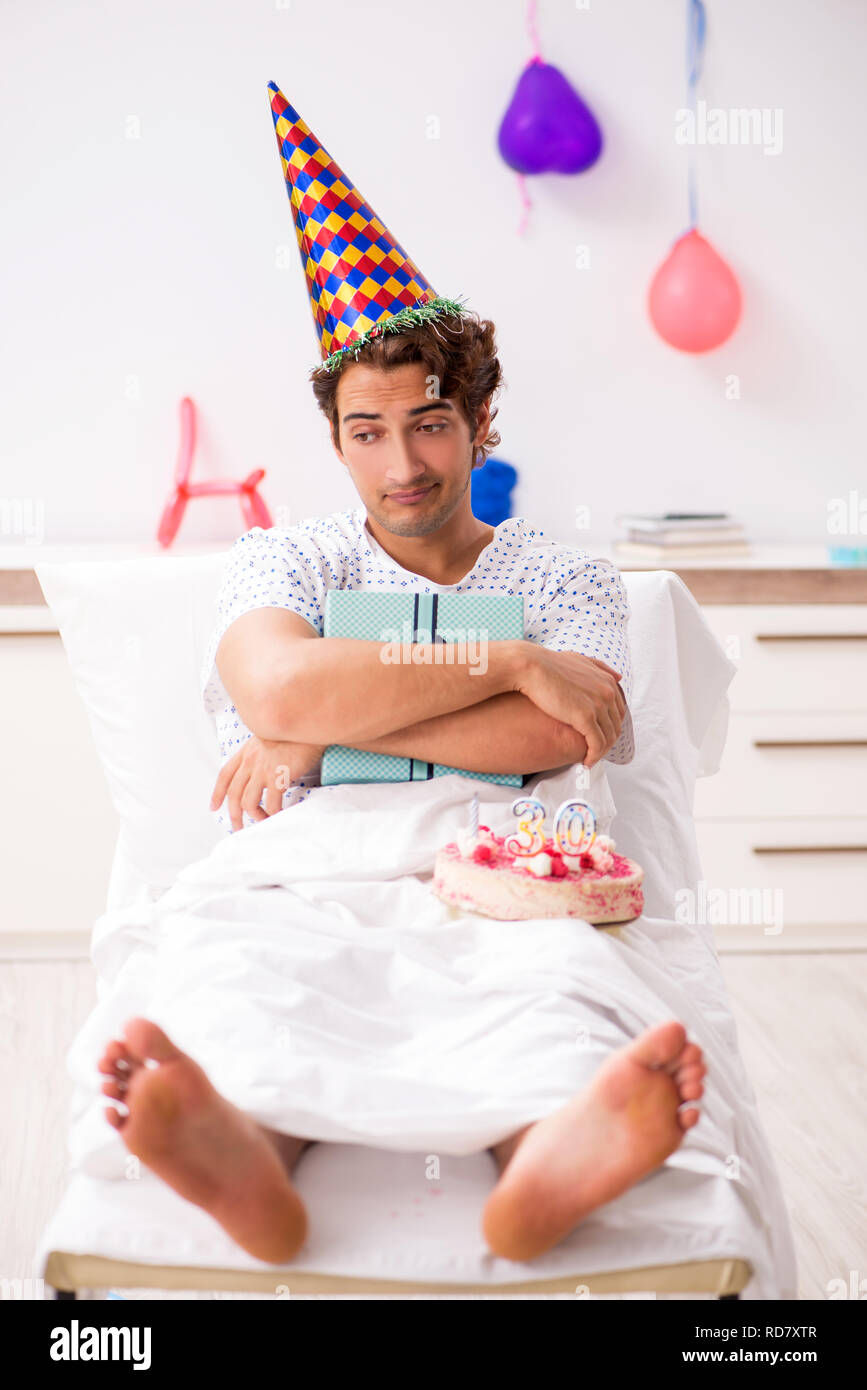 Young man celebrating his birthday in hospital Stock Photo - Alamy