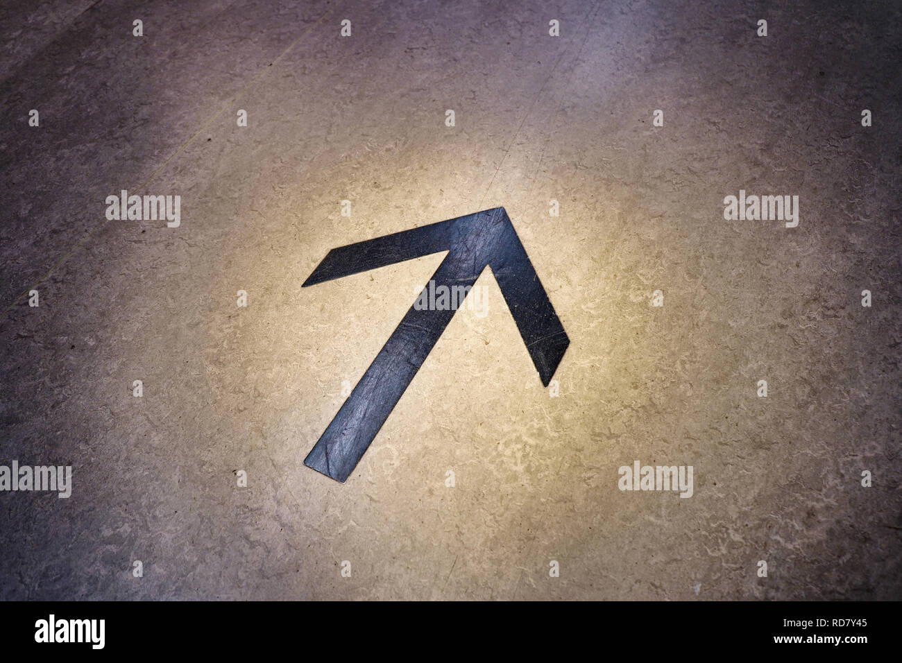 Arrow mark on floor of a large facility helps shopping customers ...