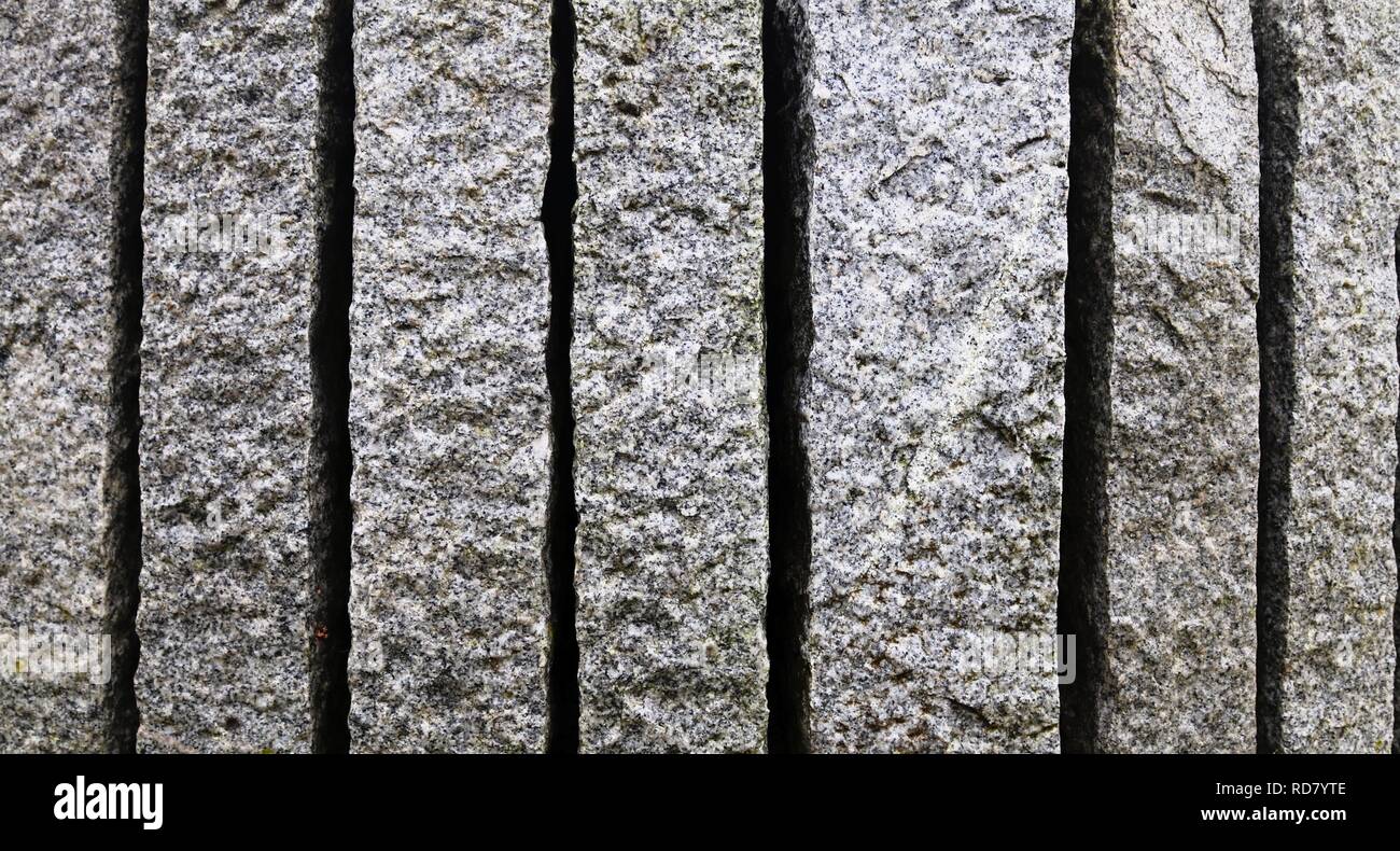 Close up high resolution surface of granite wall structures in ...