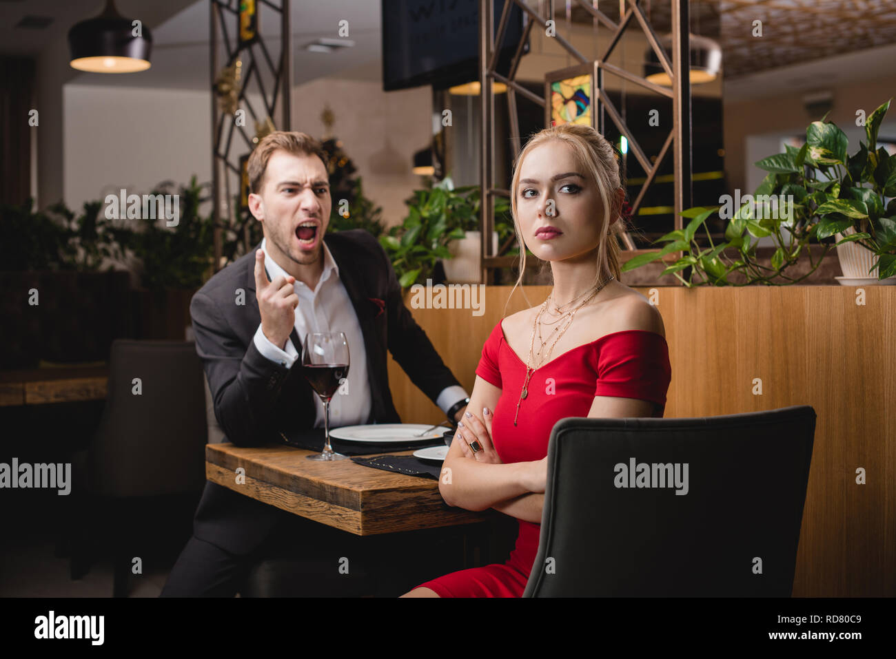 Woman yelling at man restaurant hi-res stock photography and images - Alamy