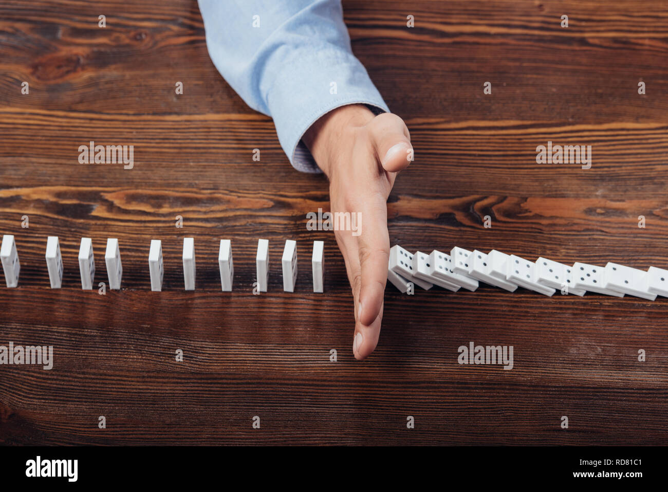 Dominoes falling top hi-res stock photography and images - Alamy