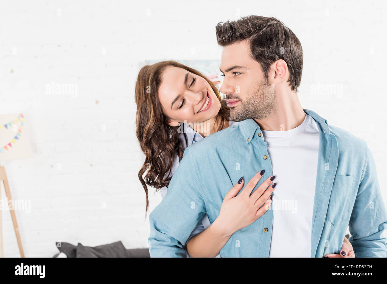Woman hugging man from hi-res stock photography and images - Alamy