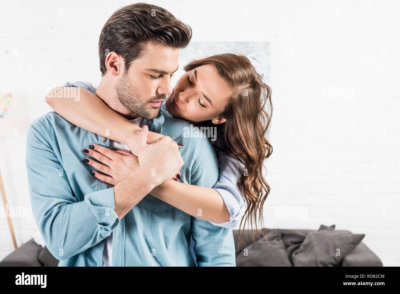 Woman hugging man from behind hi-res stock photography and images - Alamy
