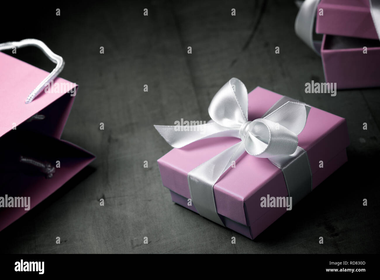 Luxury boxes tied with a white ribbon Stock Photo - Alamy