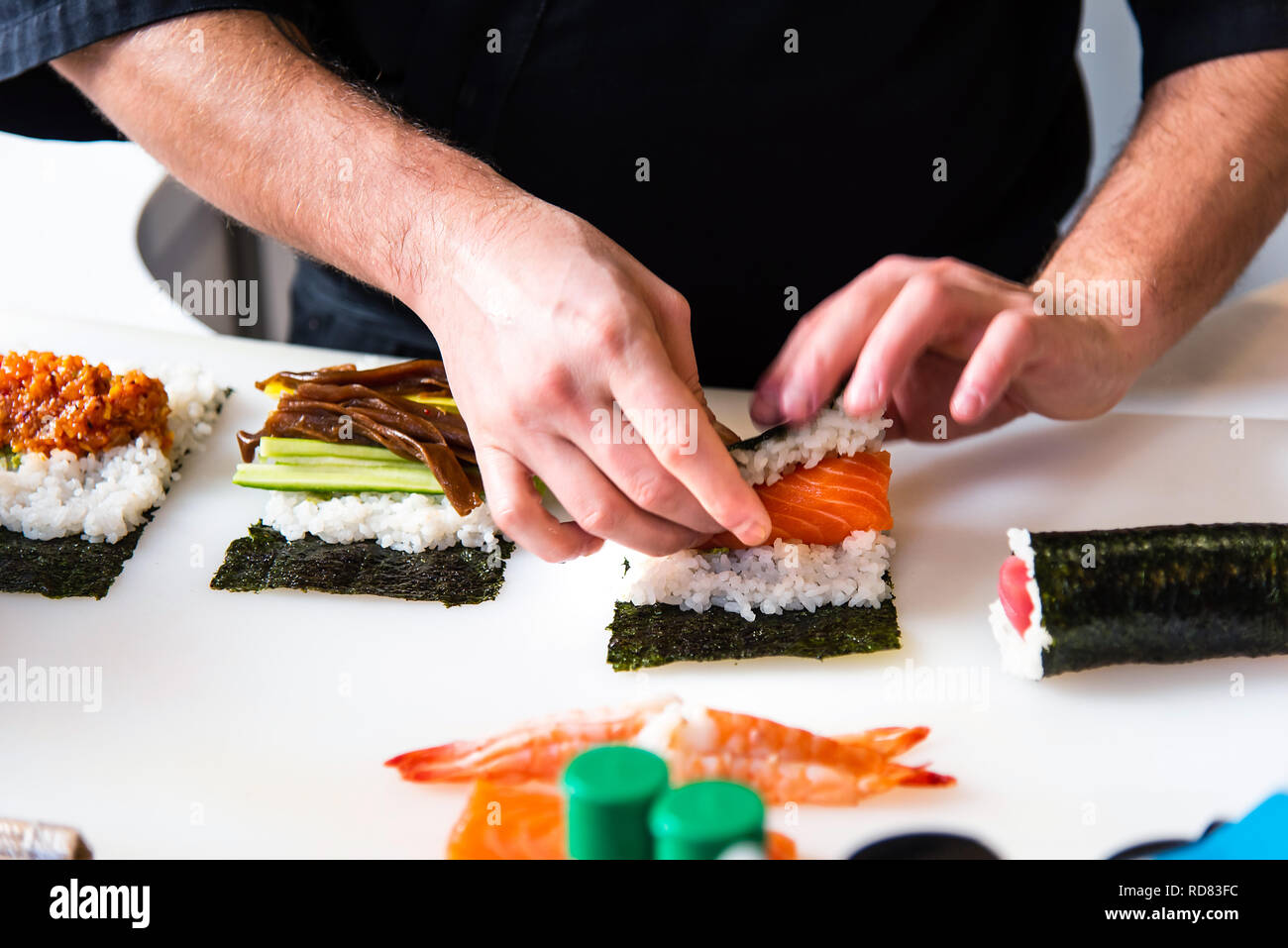 Chef making sushi in the bar close up Stock Photo - Alamy