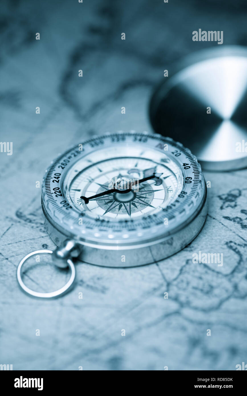 Vintage compass and old navigation map Stock Photo - Alamy