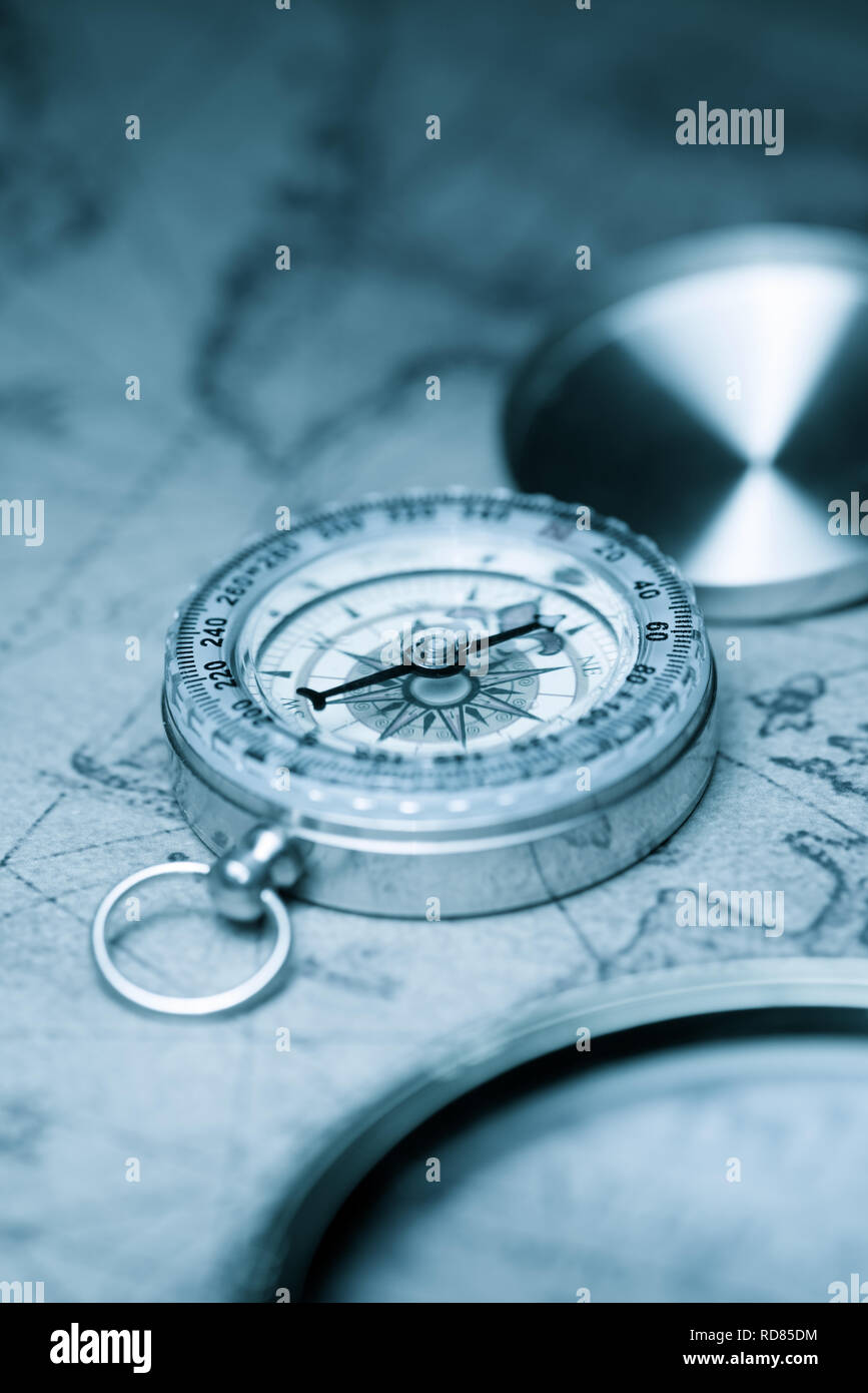 Vintage compass and old navigation map Stock Photo - Alamy