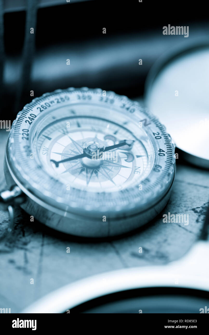 Vintage compass and old navigation map Stock Photo - Alamy