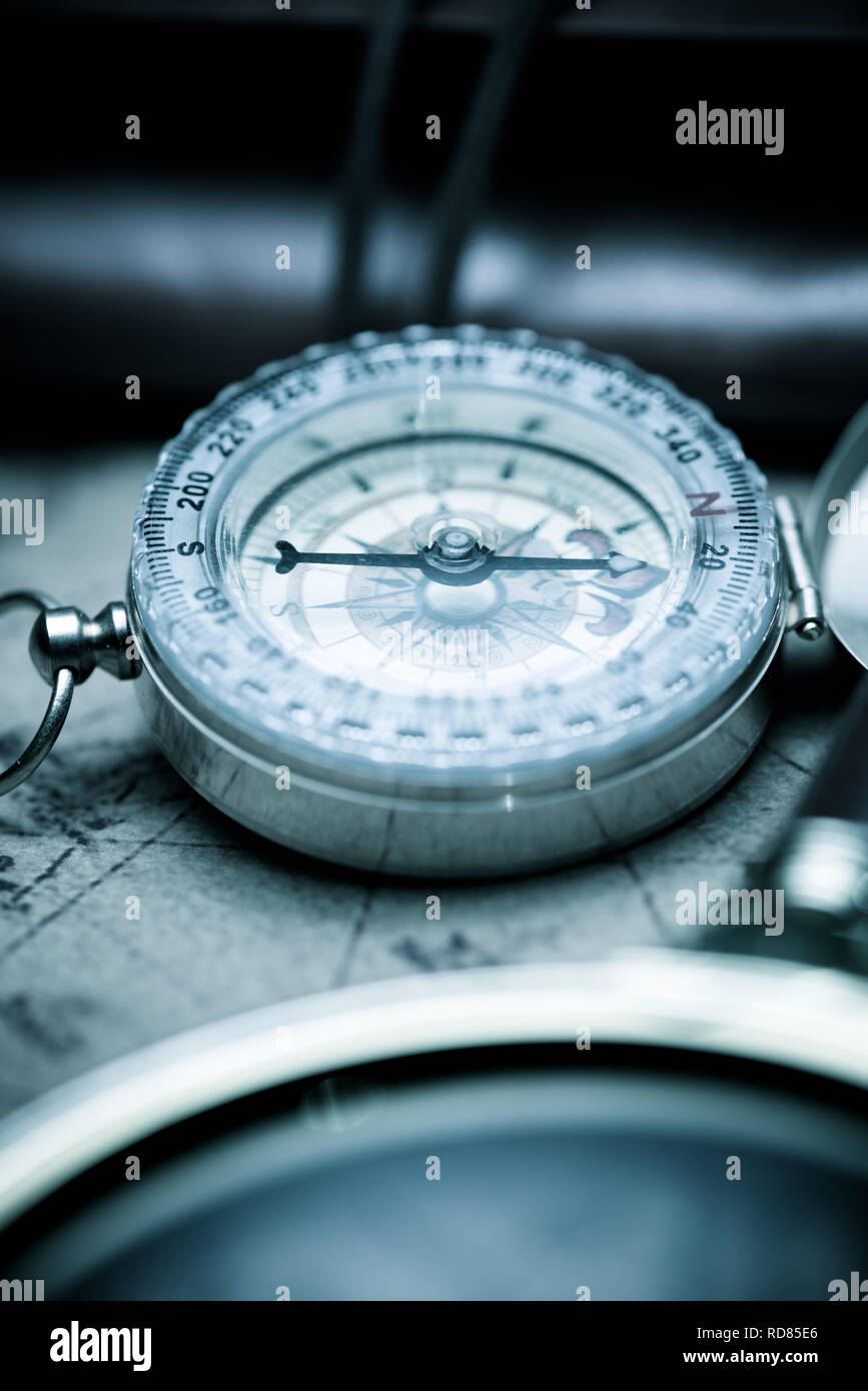 Vintage compass and old navigation map Stock Photo - Alamy