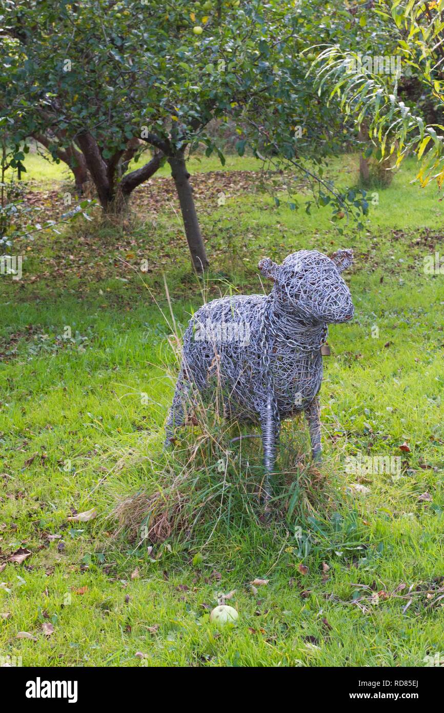 Steel sculptures of sheep in community orchard in city allotment Stock ...