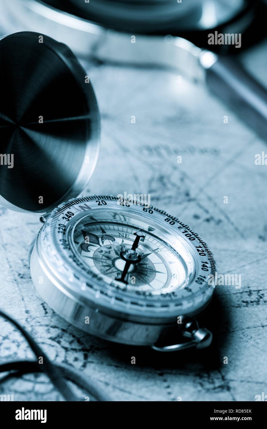 Vintage compass and old navigation map Stock Photo - Alamy