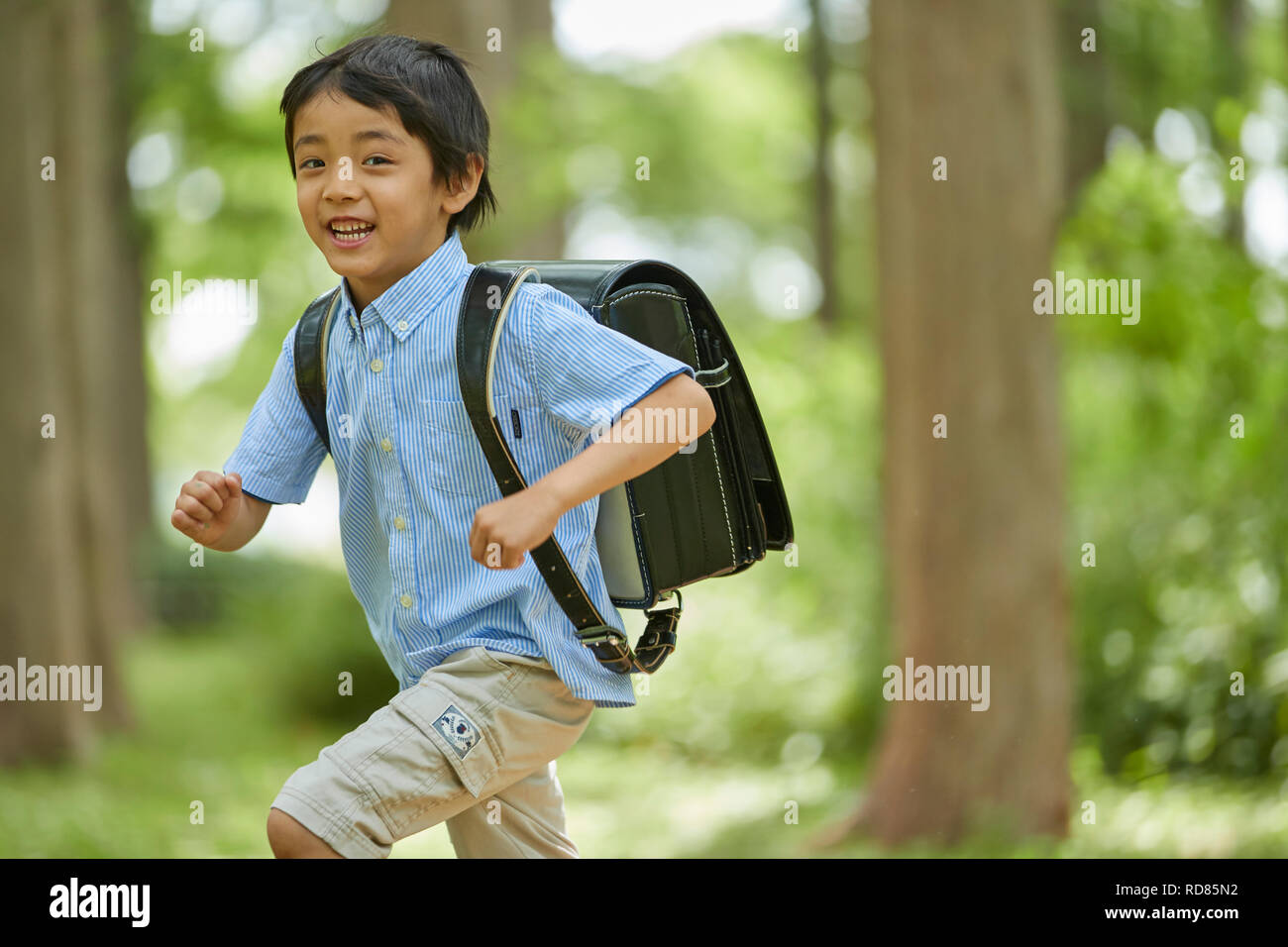 Japanese kid in a city park Stock Photo - Alamy