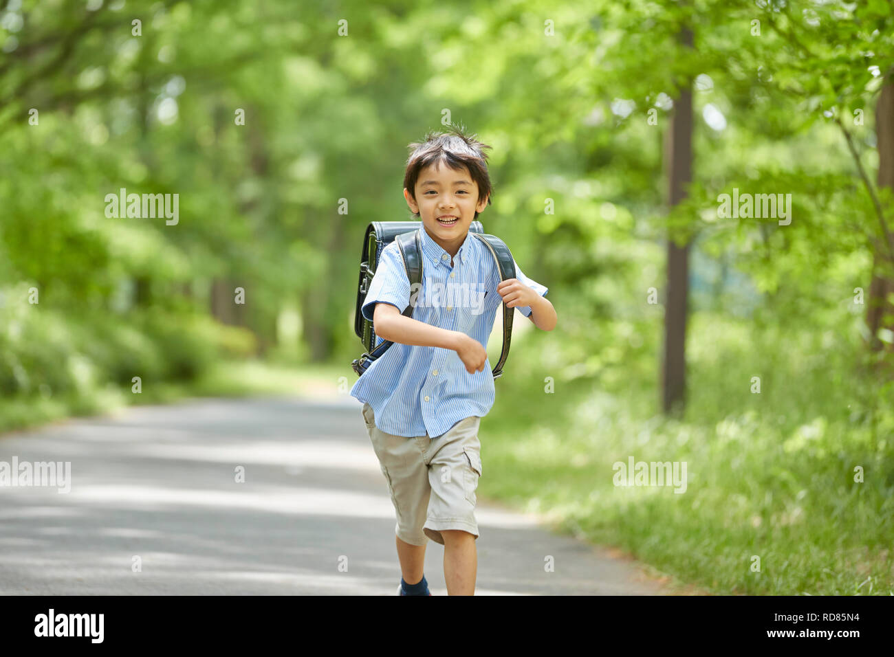 Japanese kid in a city park Stock Photo - Alamy