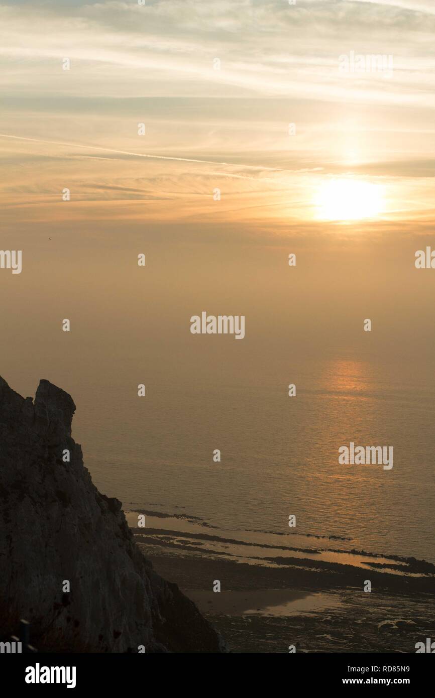 Beachy Head at sunrise in fog inversion with English channel swathed in ...
