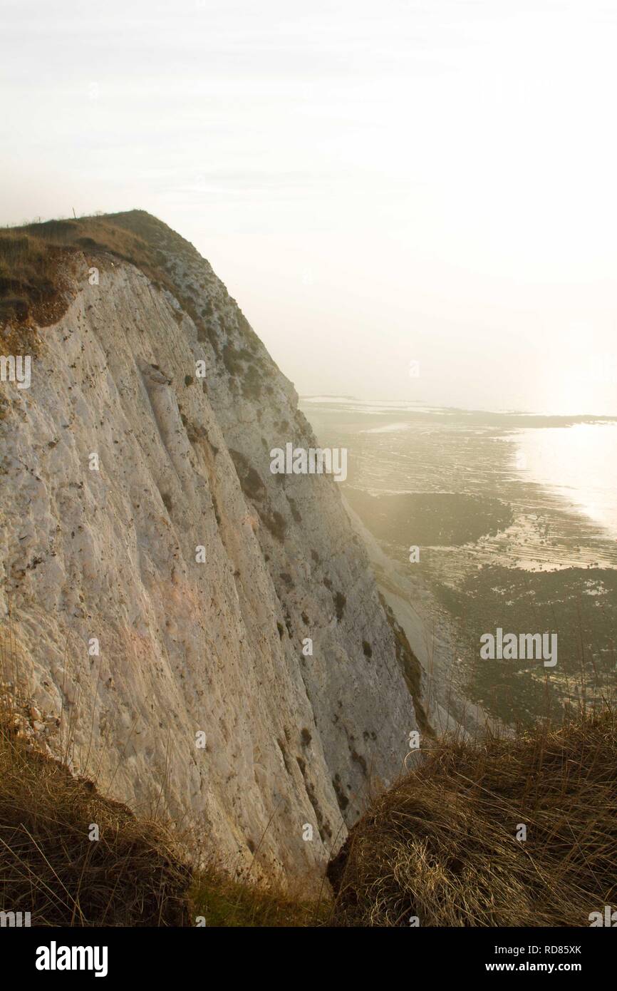 Beachy Head at sunrise in fog inversion with English channel swathed in ...