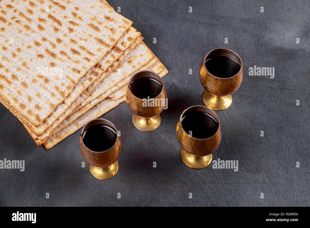 Symbols of Passover background four glasses wine and matzoh jewish ...