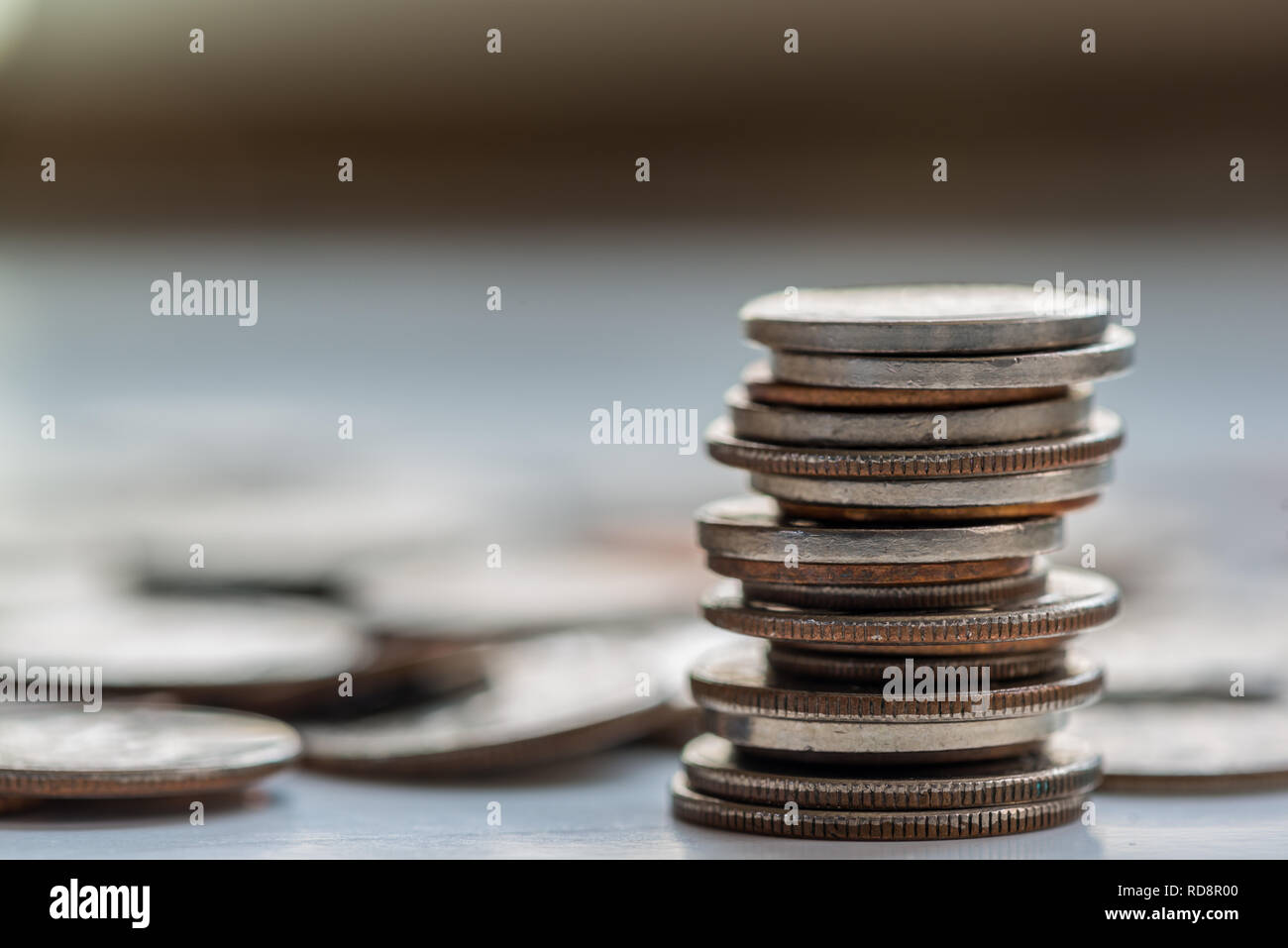 Stack and piles of coins Stock Photo - Alamy