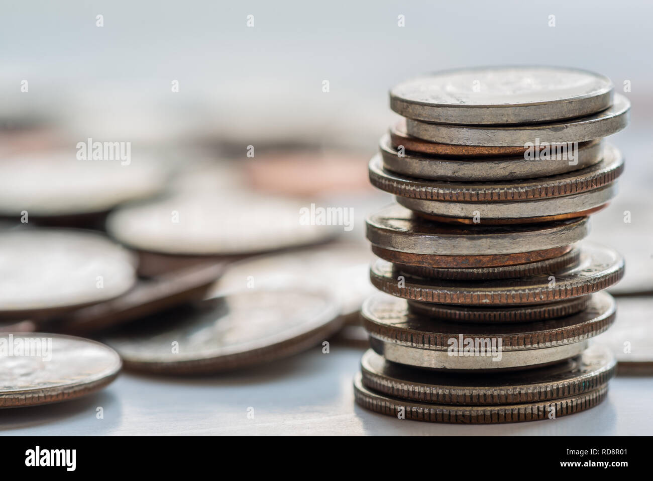 Stack and piles of coins Stock Photo - Alamy