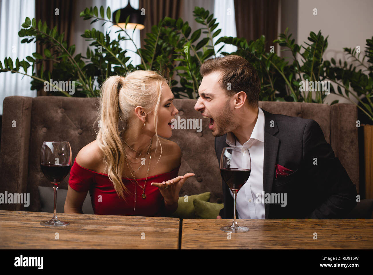 Woman yelling at man restaurant hi-res stock photography and images - Alamy